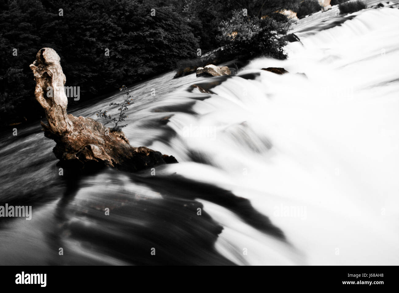 closeup flow rock waterfall current cascade forest river water motion ...