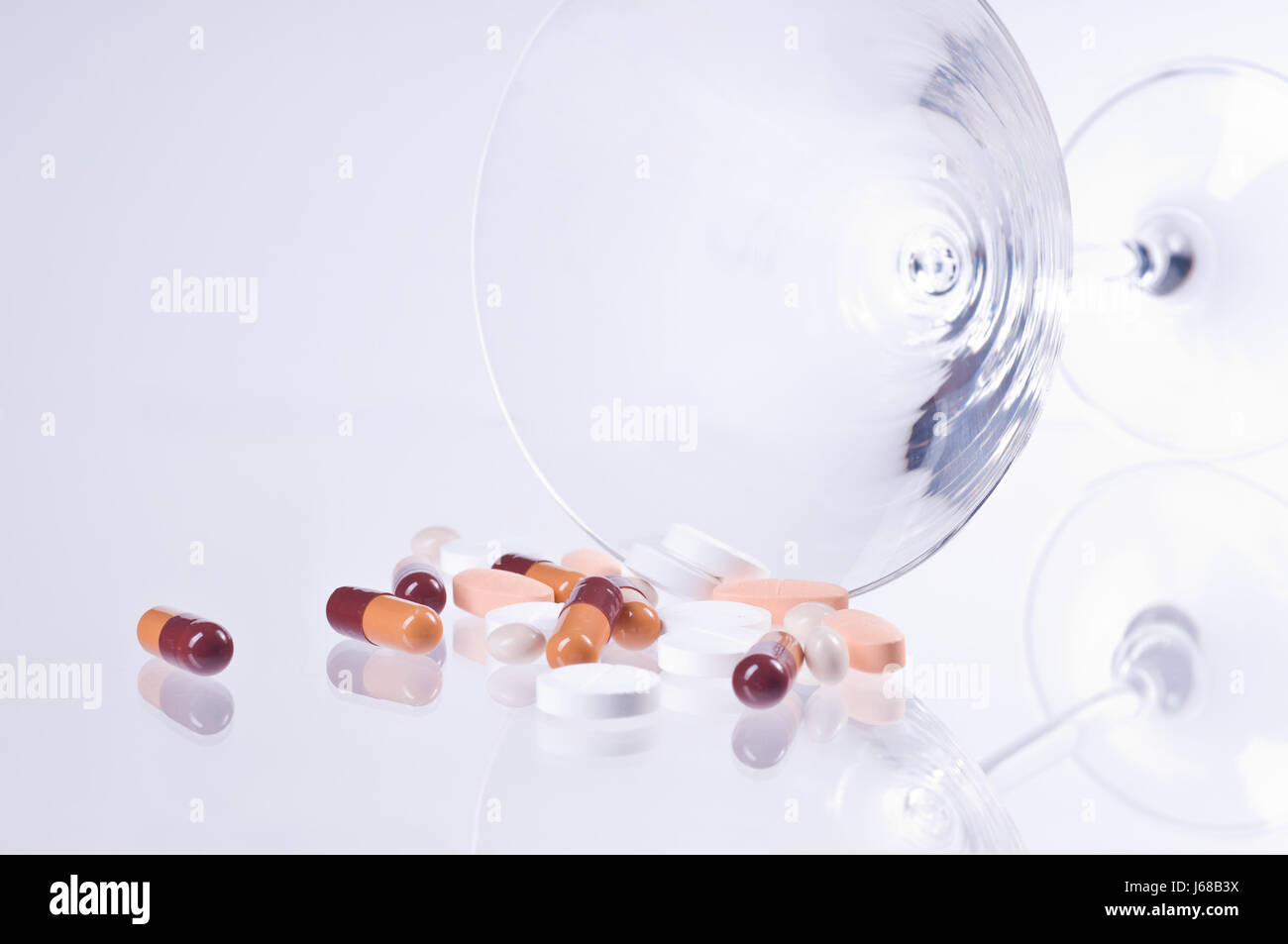 various tablets in a cocktail glass on a white background Stock Photo ...
