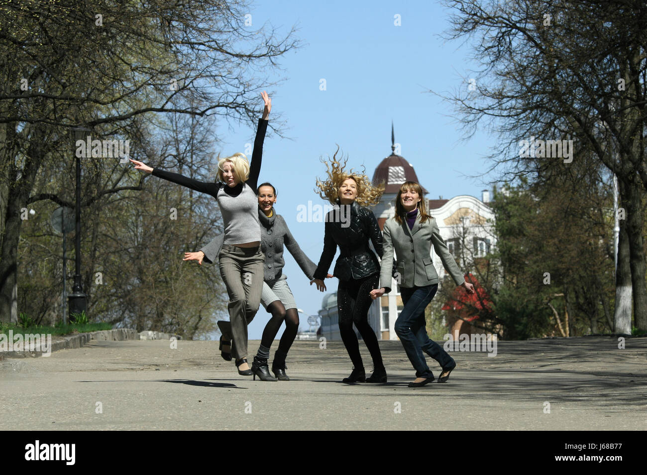 woman women spring bouncing bounces hop skipping frisks jumping jump ...