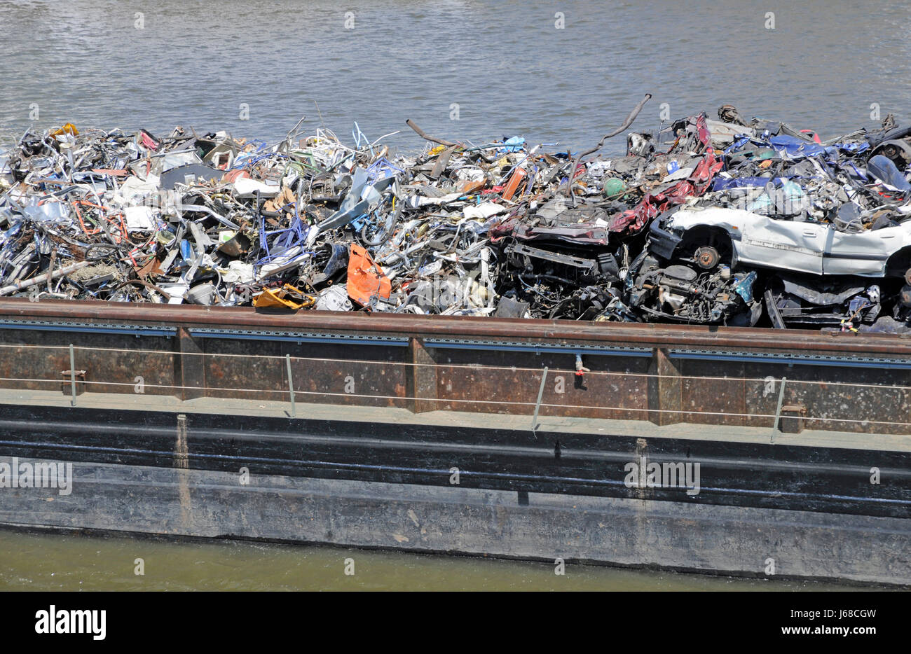 scrap metal on a barge Stock Photo - Alamy