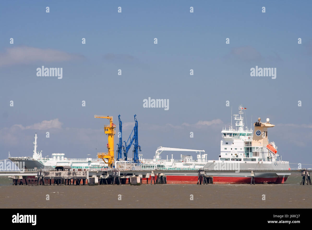 oil and chemical tanker discharge crane Stock Photo - Alamy
