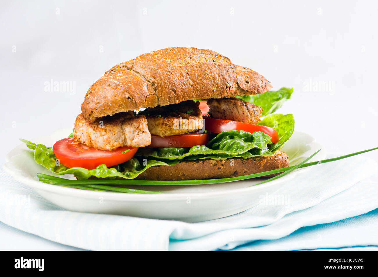 belegtes wholemeal rolls with pork,lettuce,tomatoes and peppers Stock ...