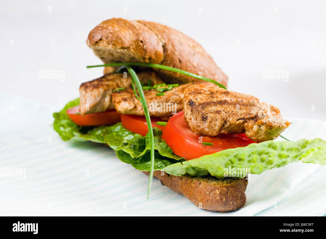 belegtes wholemeal rolls with pork,lettuce,tomatoes and peppers Stock ...