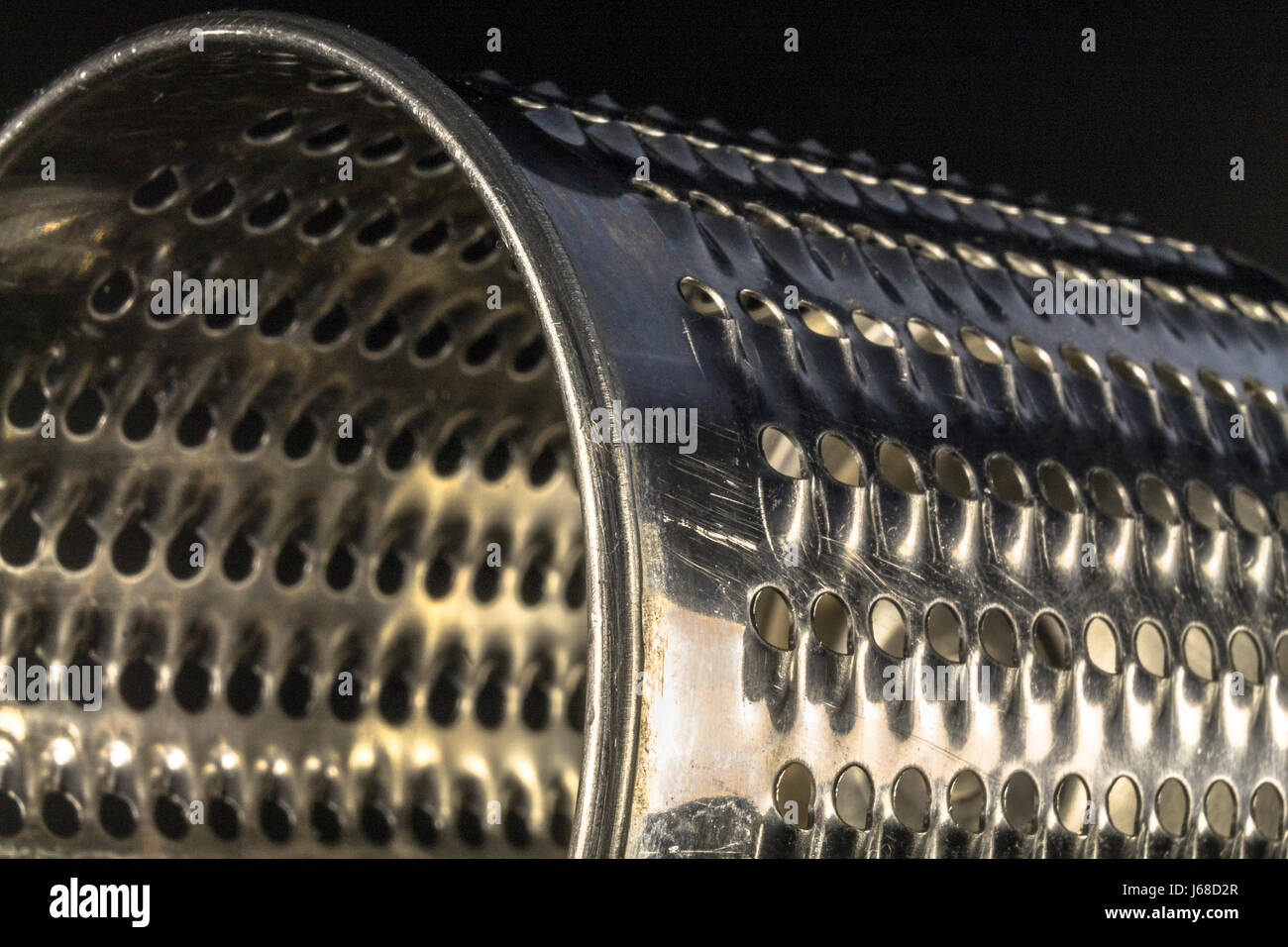 Close up of round grater Stock Photo - Alamy