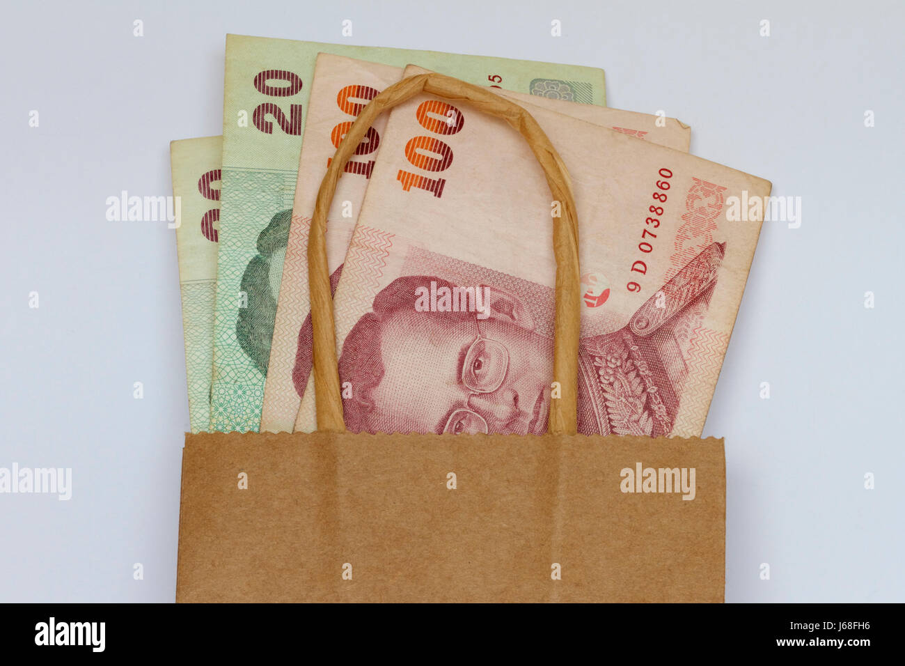 Thai baht money in a bag Stock Photo - Alamy