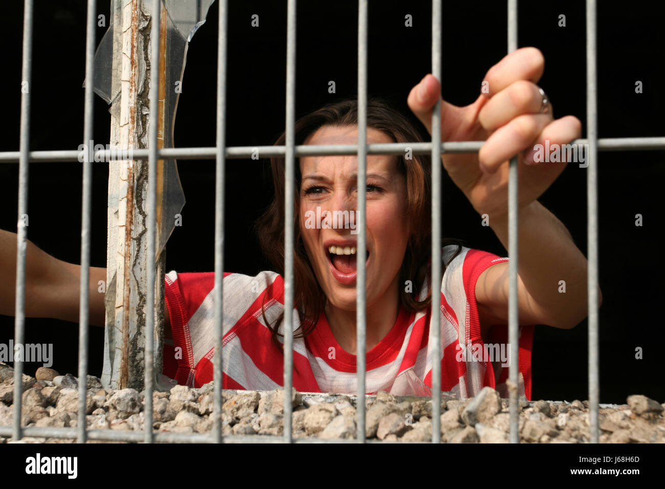 cry for help in prison Stock Photo - Alamy