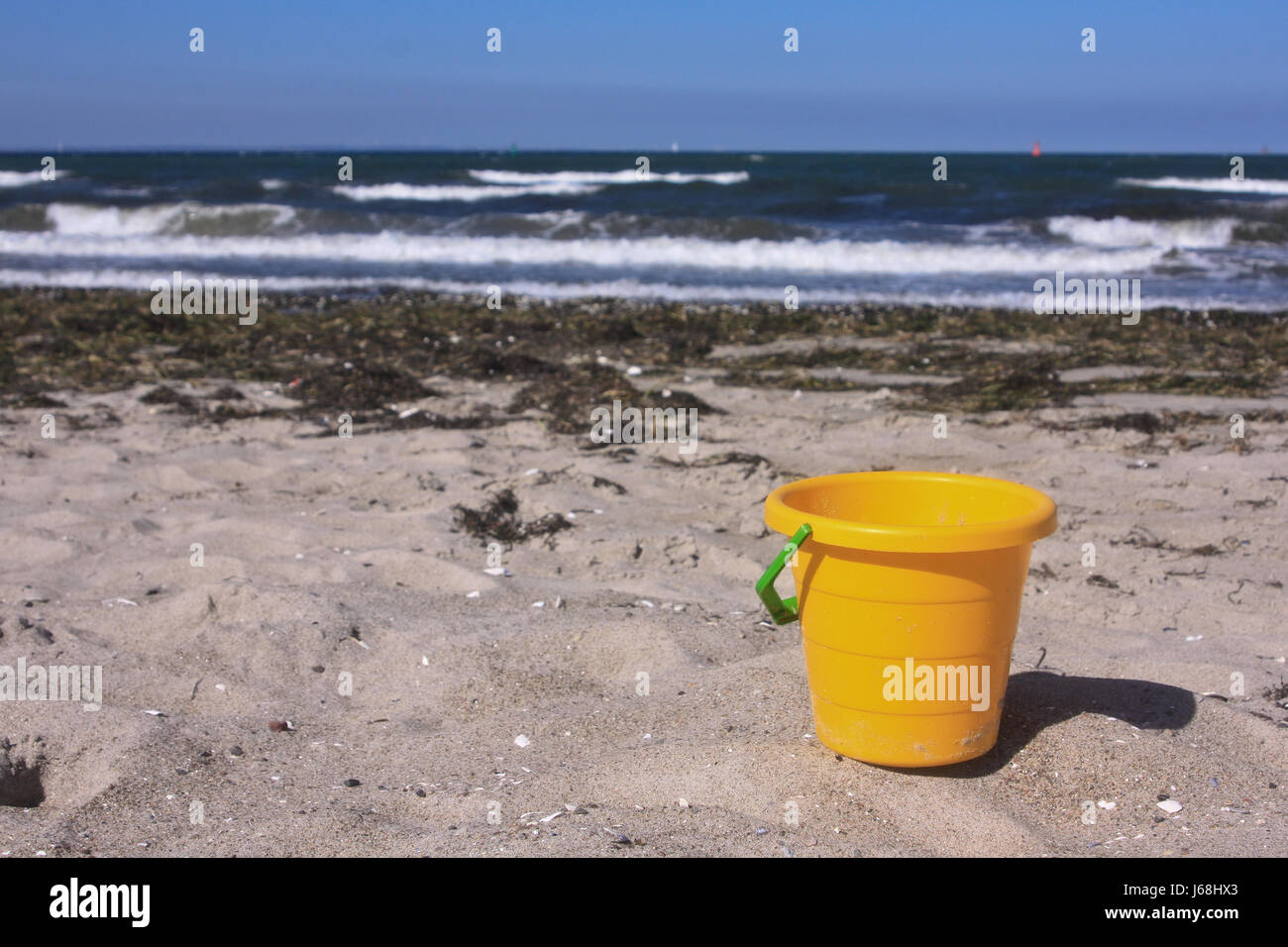 sand bucket on the beach Stock Photo - Alamy