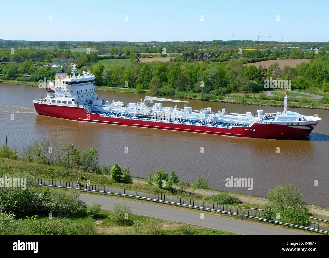 channel transport freighter waterway cargo ship red sailing boat ...