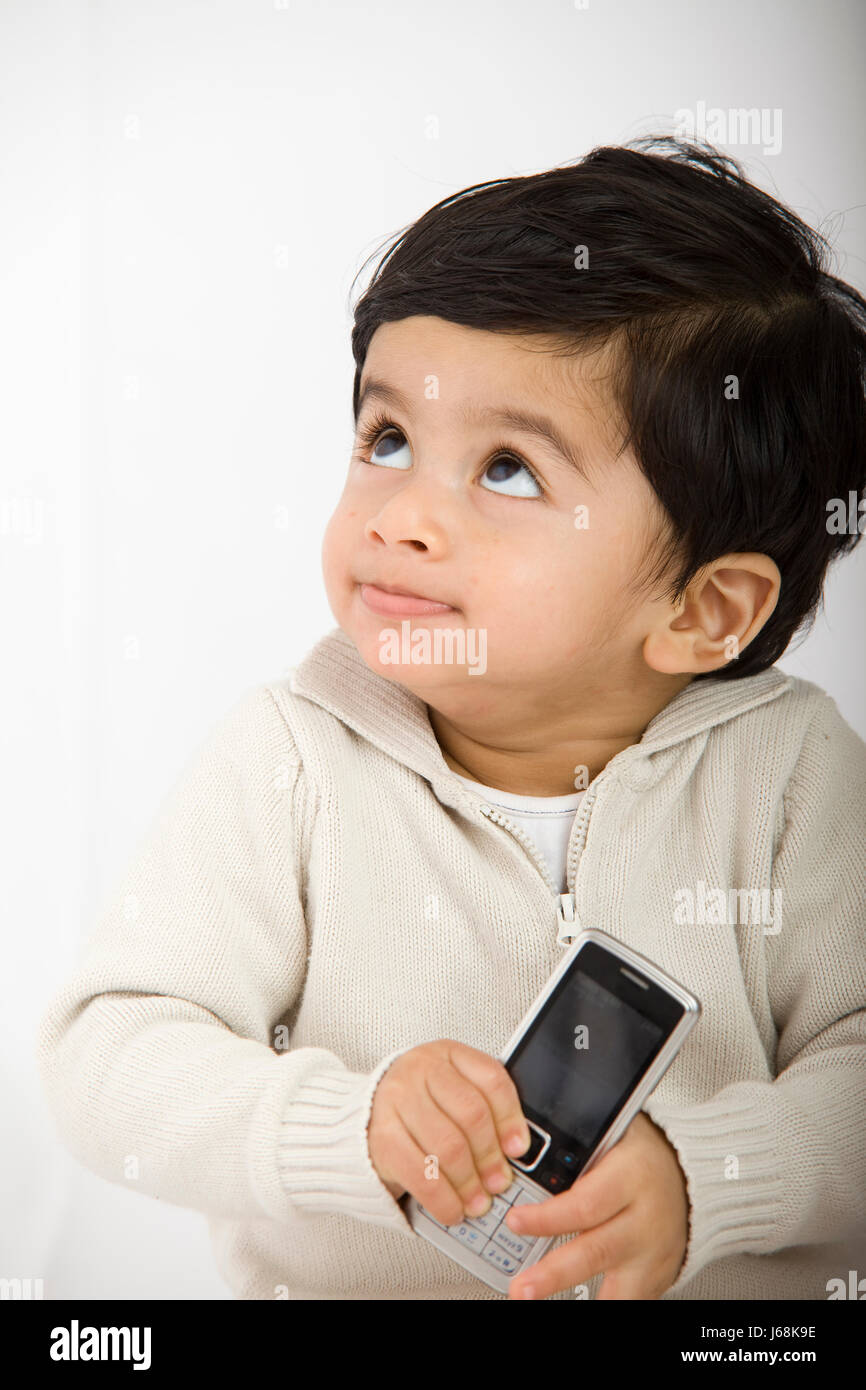 boy with mobile phone looking up Stock Photo - Alamy