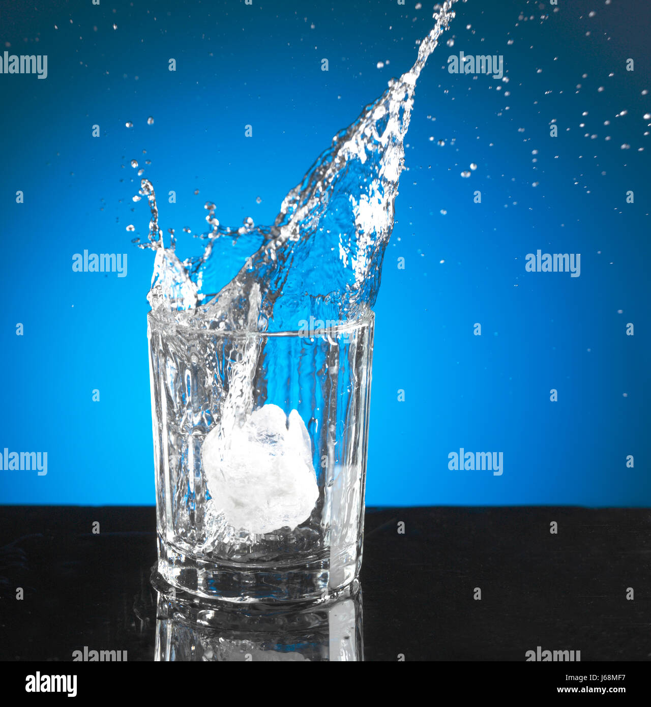 squirt ice cube water splashes glass chalice tumbler soluble glass ...