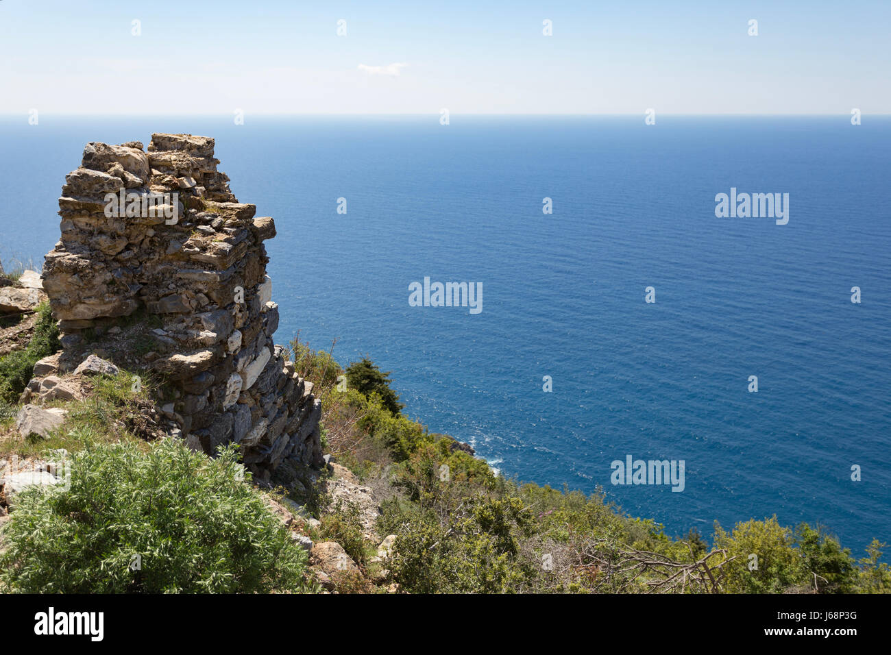 Ruins of ancient walls located uphill by sea in historical and ...
