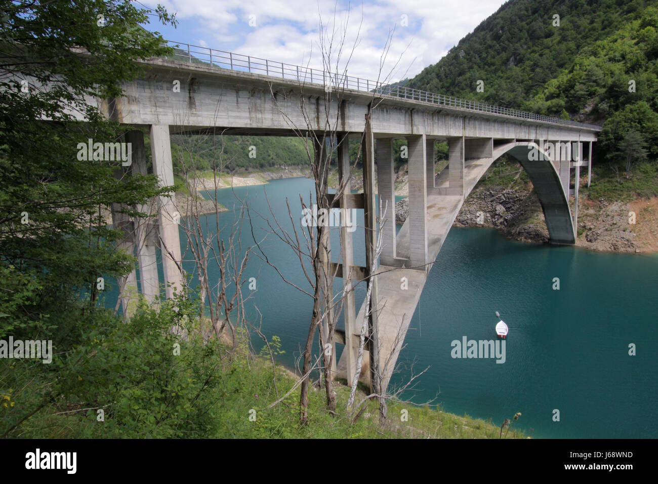 bridge forested mountain italy tree shrub valley rowing boat sailing ...