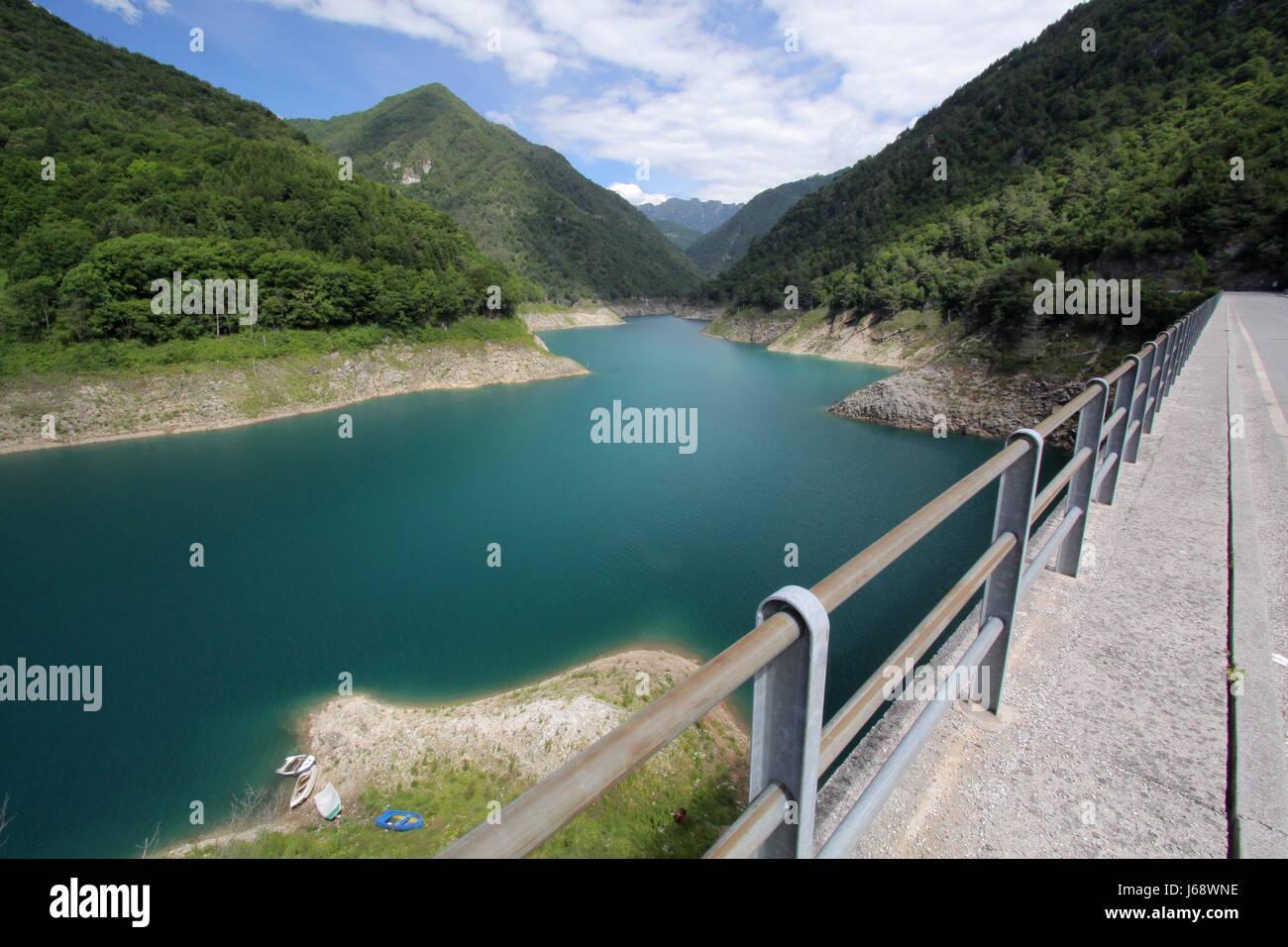 bridge forested railing mountain italy tree shrub valley steep bank ...