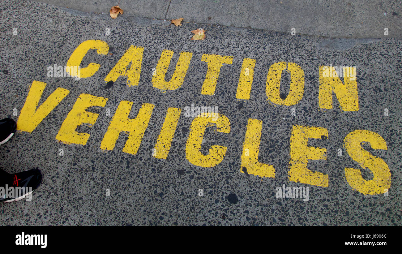 Caution: Vehicles sign Stock Photo - Alamy