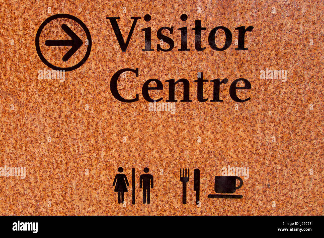 Rusty metal visitor sign Stock Photo - Alamy
