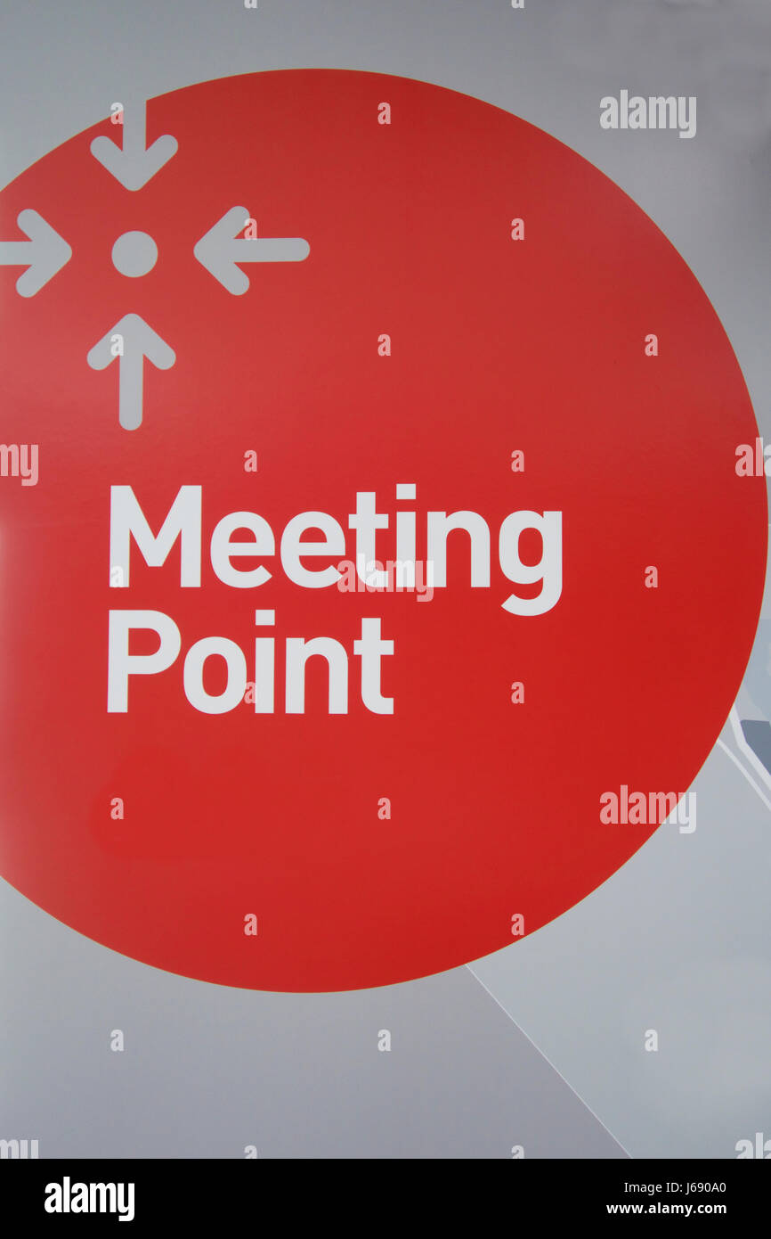 Meeting point signage at an airport Stock Photo - Alamy