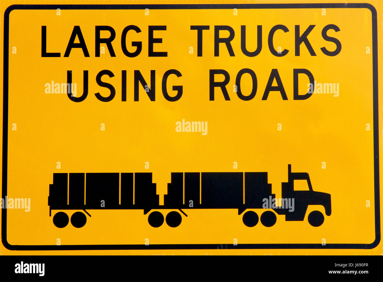 Large trucks using road sign Stock Photo - Alamy