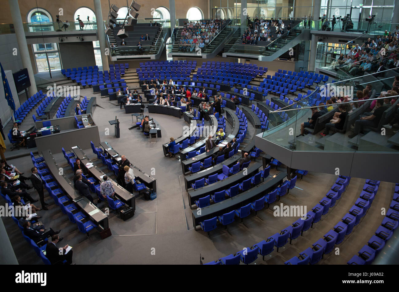 A few members of parliament and viewers await the beginning of a ...