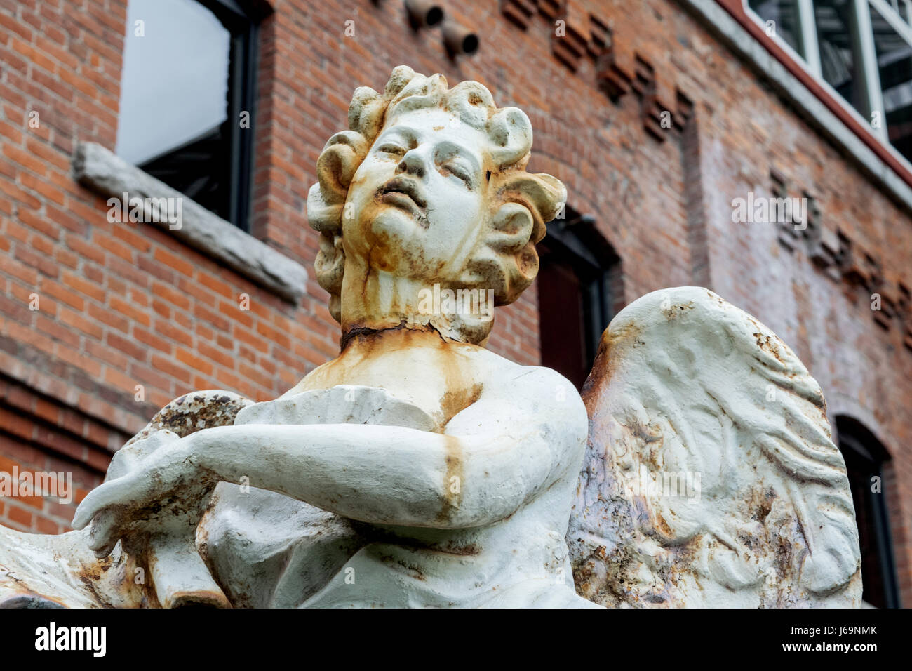 Weather worn angel Stock Photo - Alamy