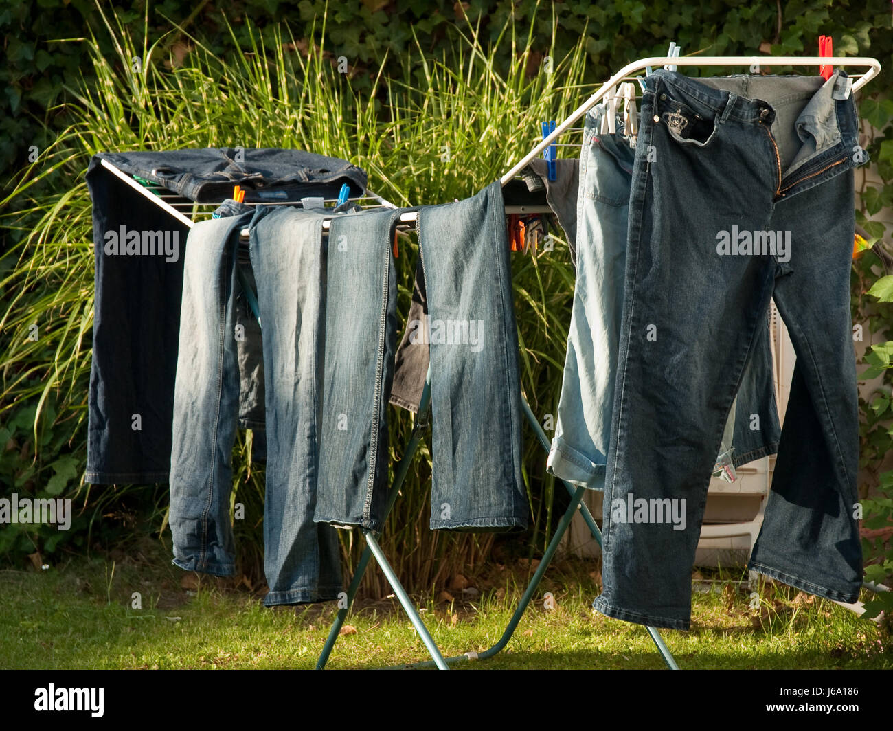 dry laundry hanged outfit clothes clothing blue green jeans trousers ...