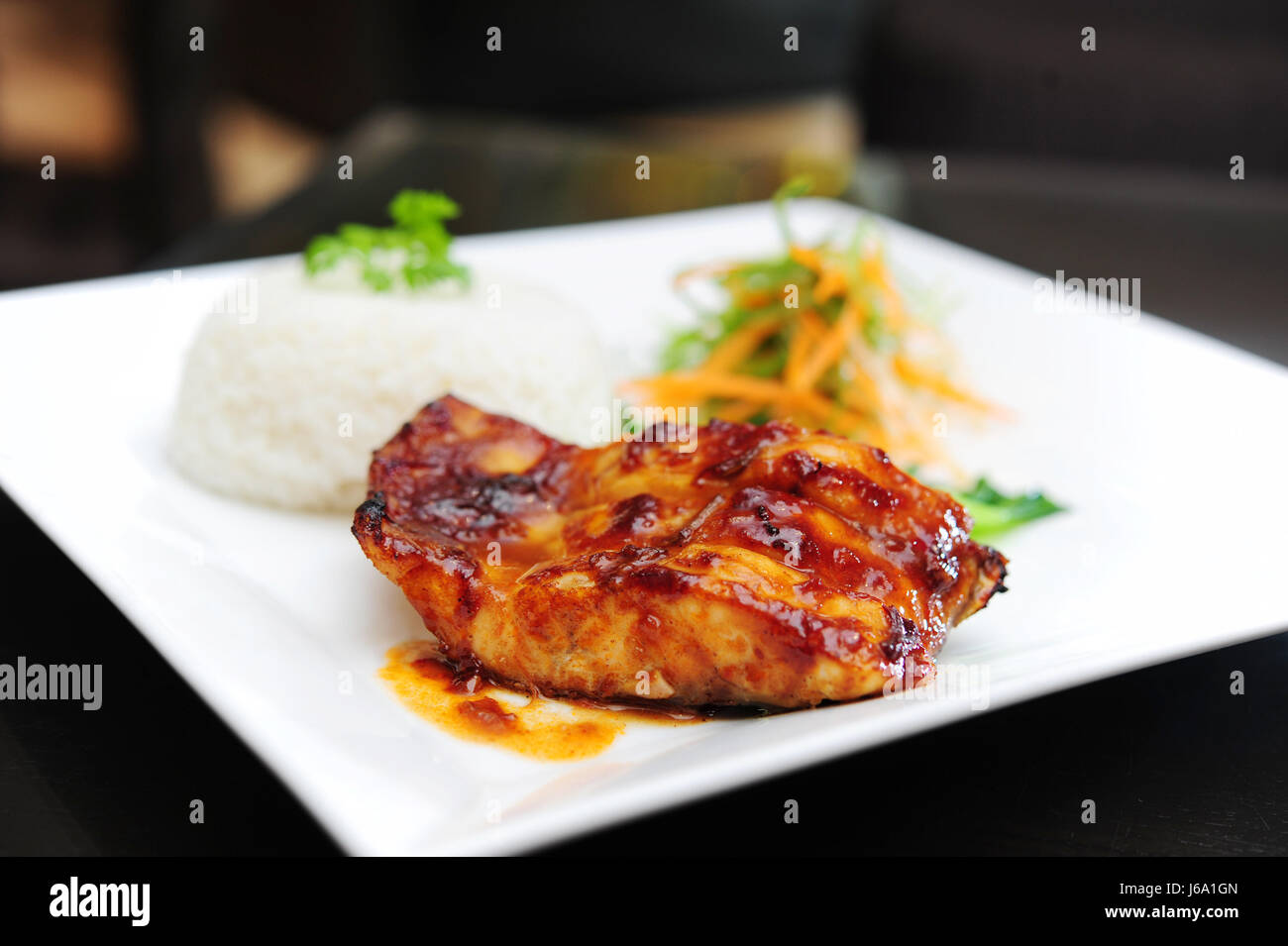 Grilled sturgeon fish fillet with rice and salad Stock Photo - Alamy