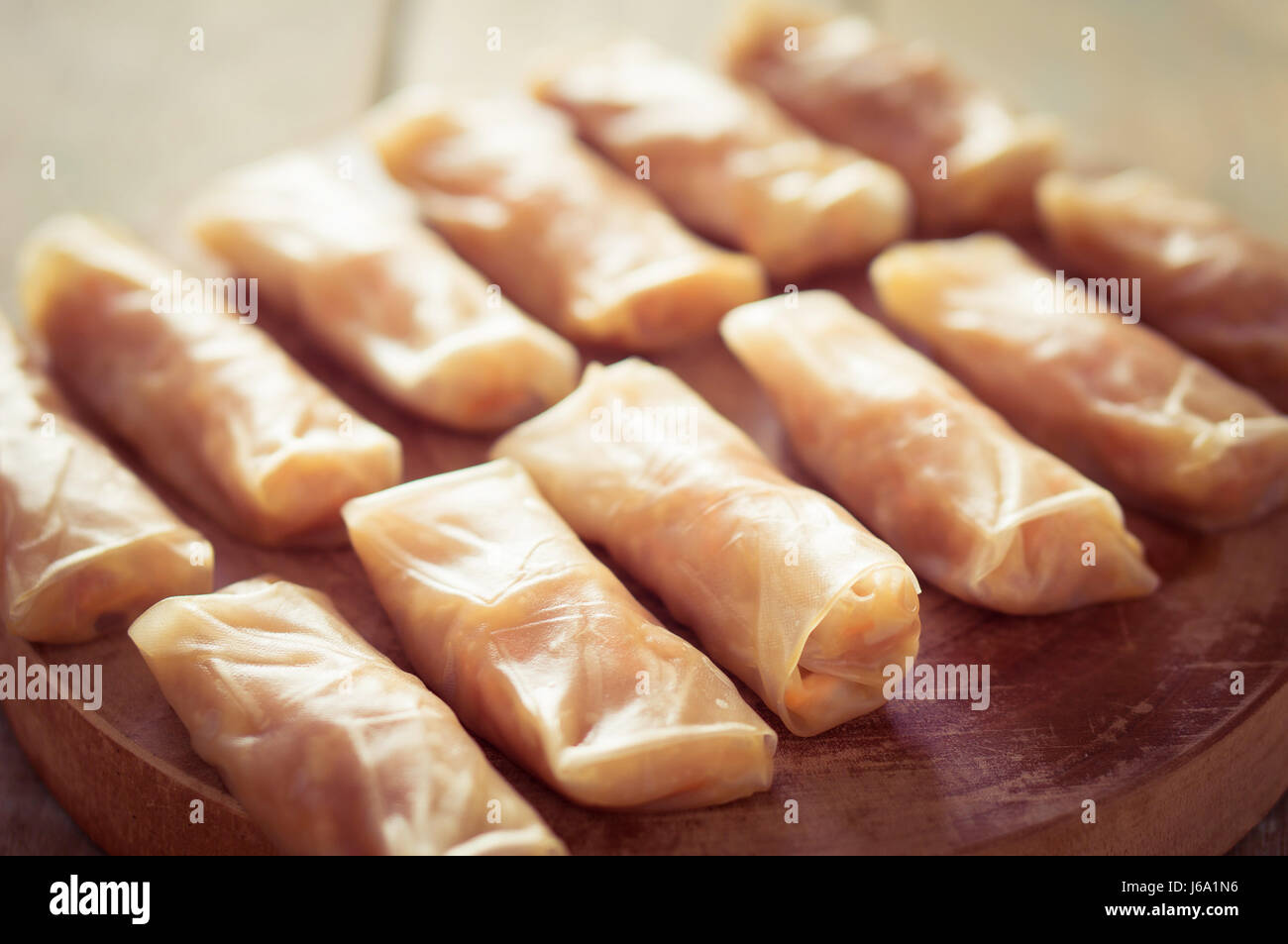 Vietnamese spring rolls on wooden cutting board Stock Photo - Alamy