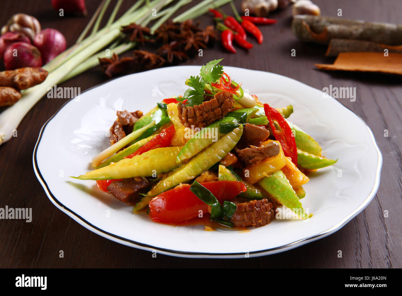 Sweet and sour sauteed pig's kidney with cucumber and tomatoes Stock ...