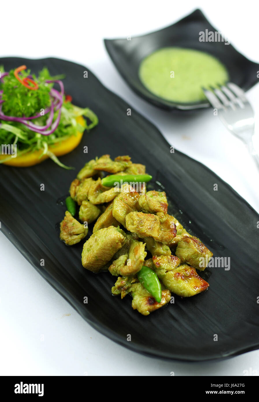 Grilled crocodile with butter chili sauce and salad Stock Photo - Alamy