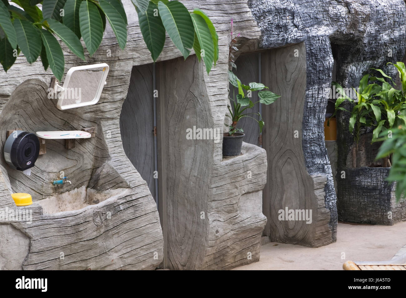 processed toilet in a tree trunk Stock Photo - Alamy