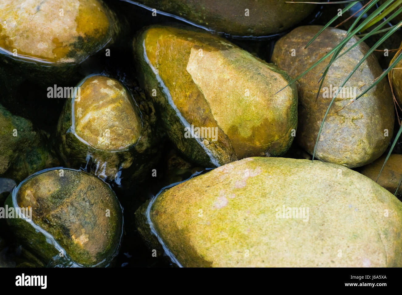 stone round about boulder boulders yellow water stones light stone ...