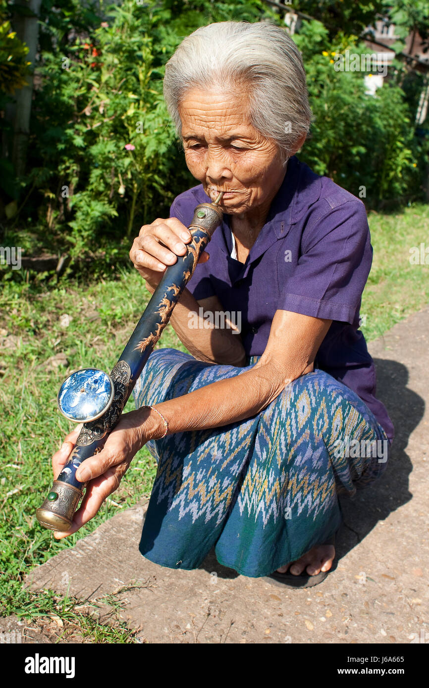 Old woman smoking tobacco hi-res stock photography and images - Alamy
