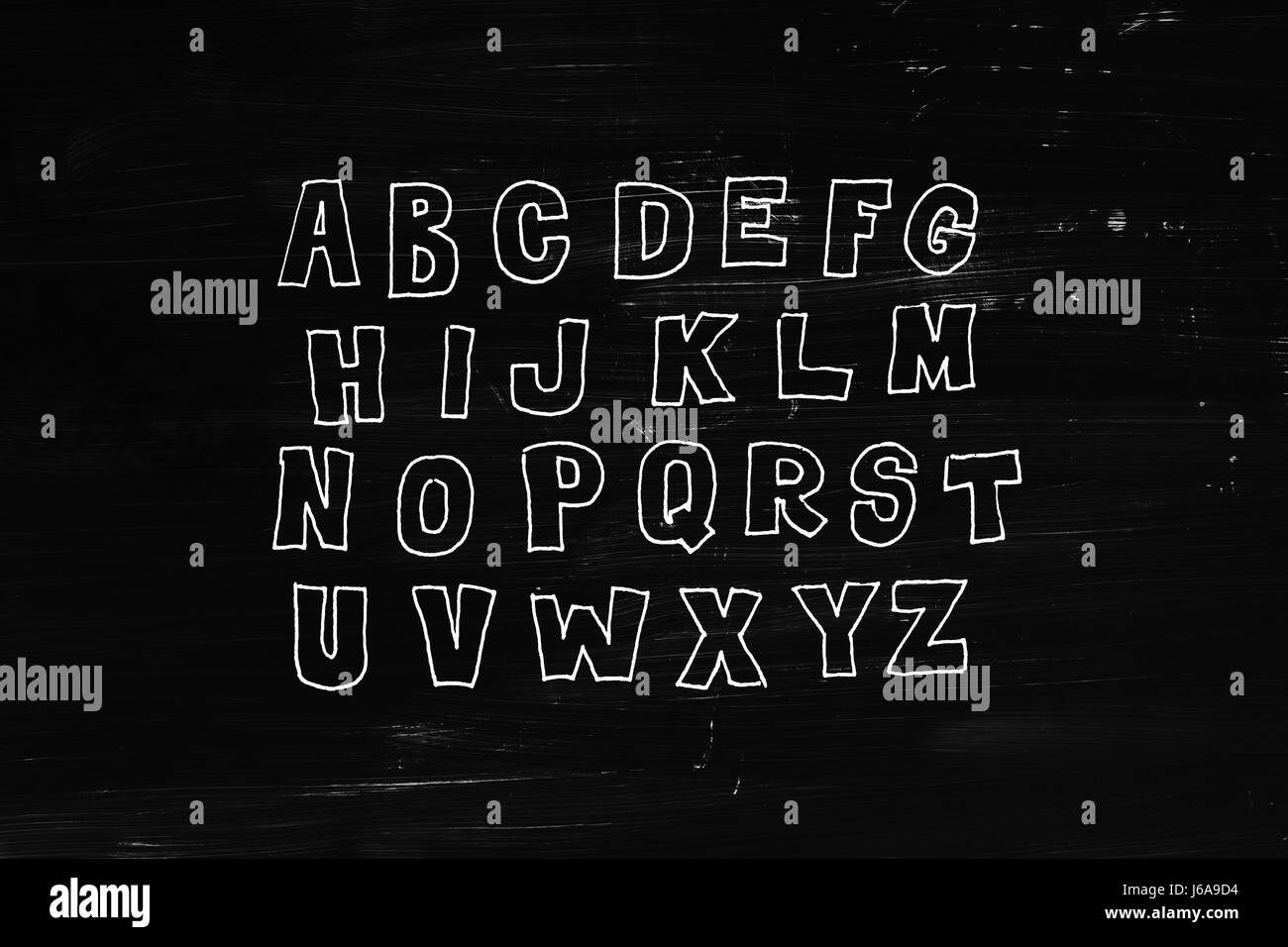 Hand drawn abc, doodle style. White letters over black chalkboard ...