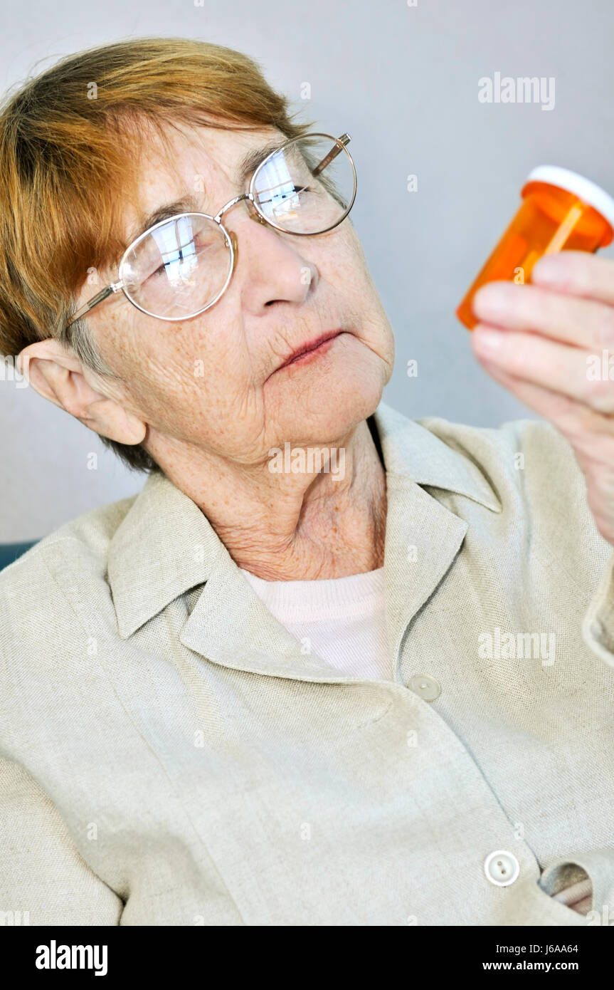 woman bottle pills drugs old elderly senior senior citizen elderly ...