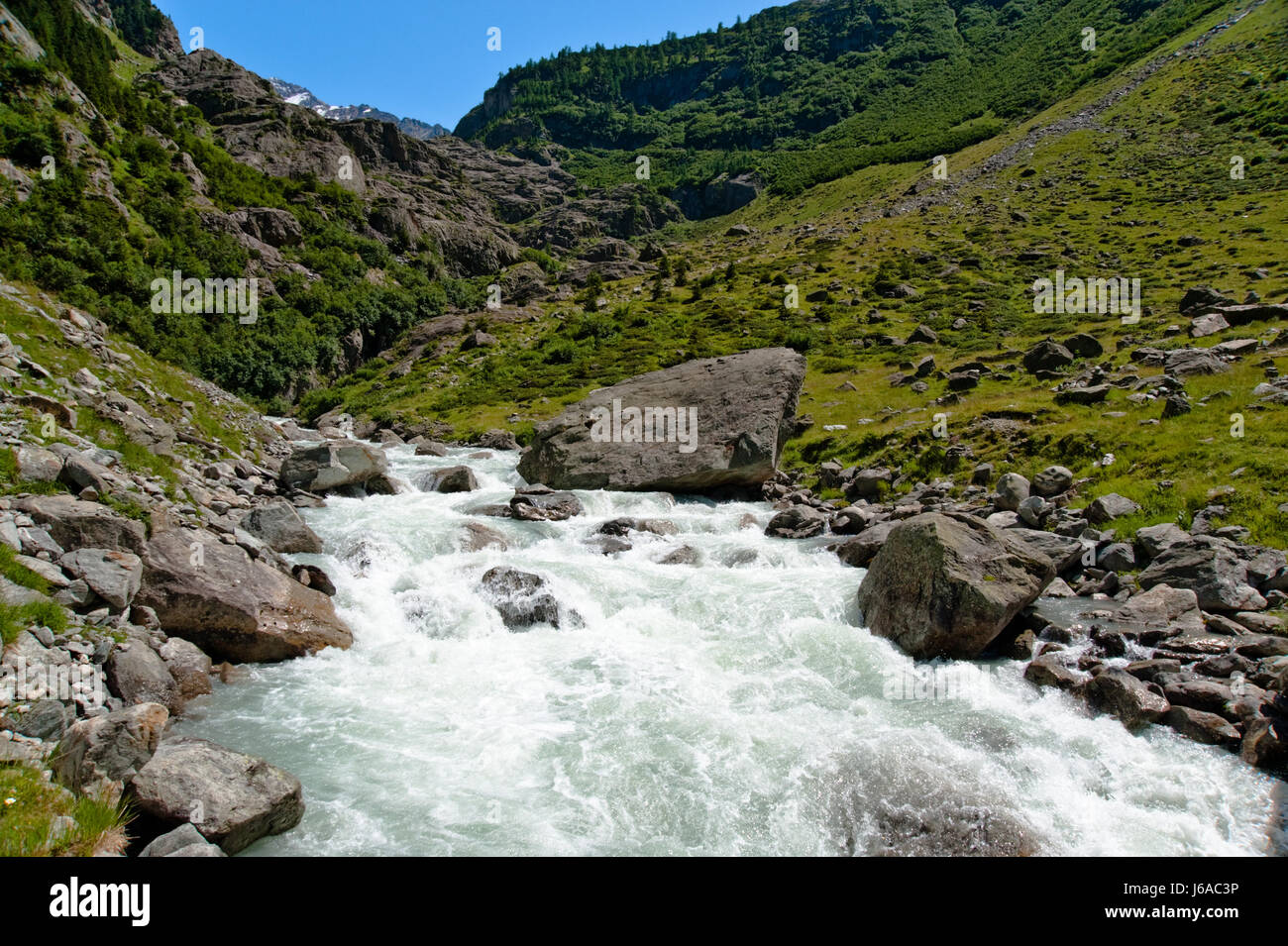 mountains alps source travelling river water stones mountains alps rock ...