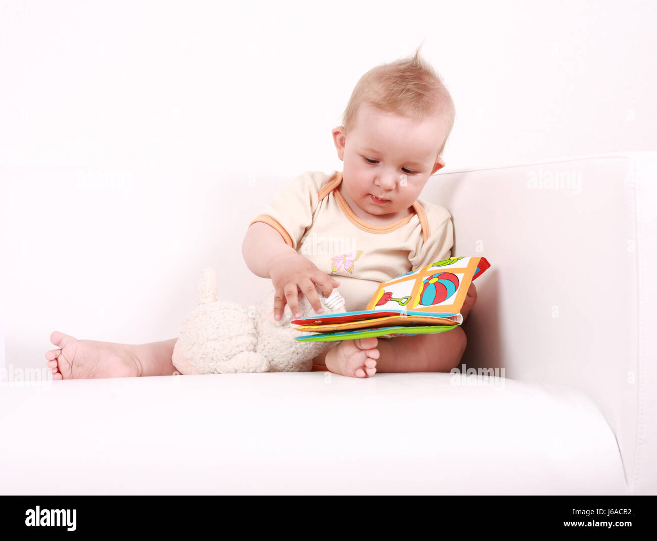 education portrait toy baby reading book child laugh laughs laughing ...