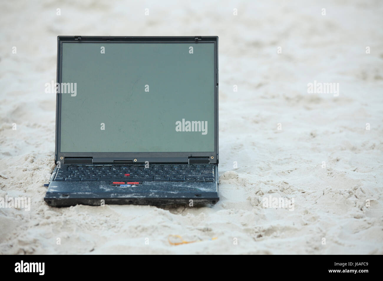 laptop in sand Stock Photo - Alamy