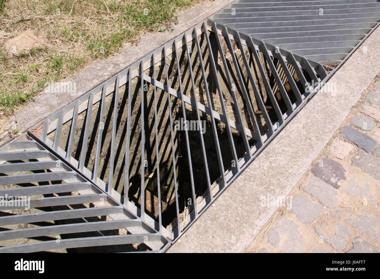 metal grid as rain runoff Stock Photo - Alamy