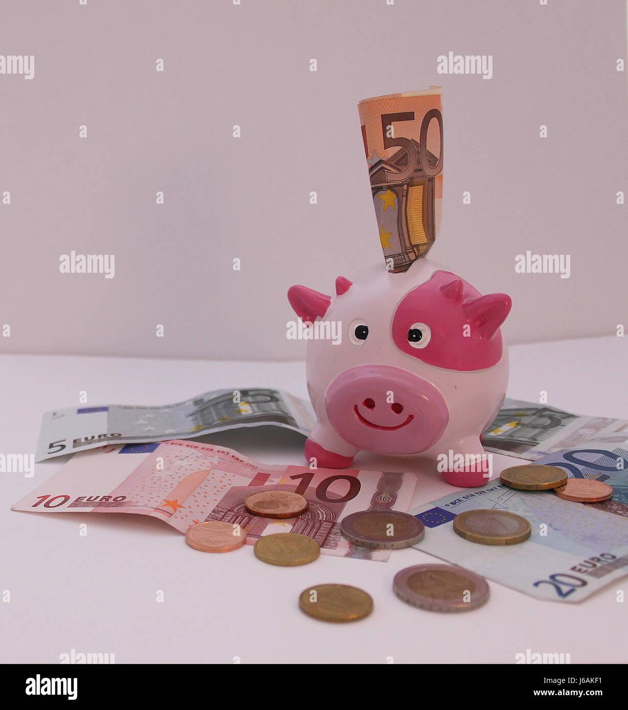 money box with money Stock Photo - Alamy