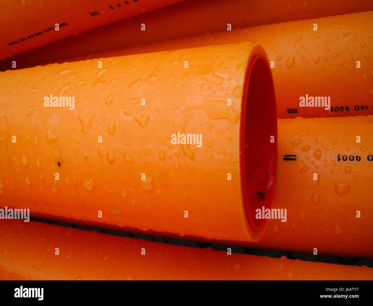 orange empty pipes Stock Photo - Alamy