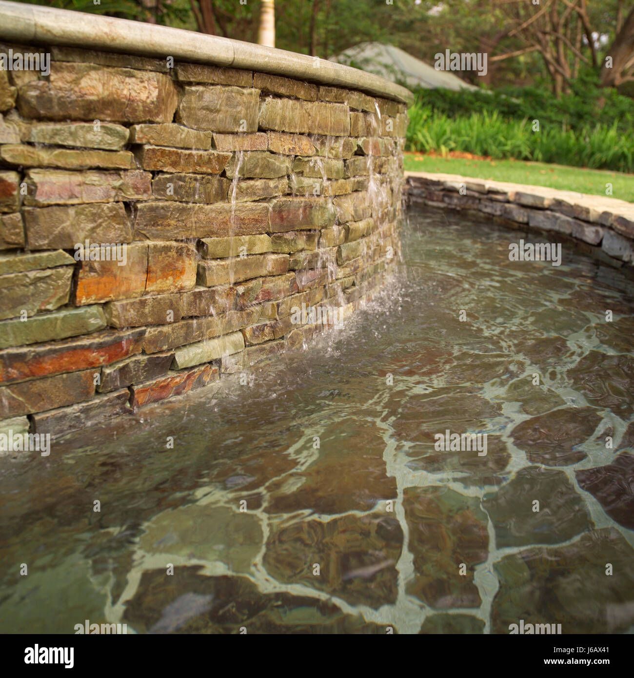 flow stone rock wall central america fountain crooked warped ...