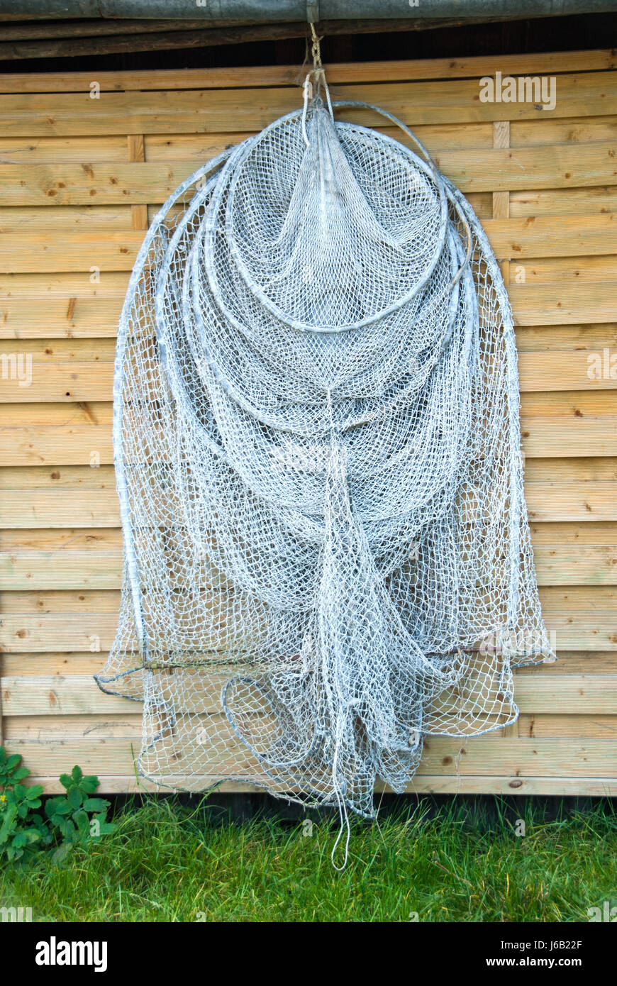 Fishing Net on a Hut Wall Stock Photo - Alamy