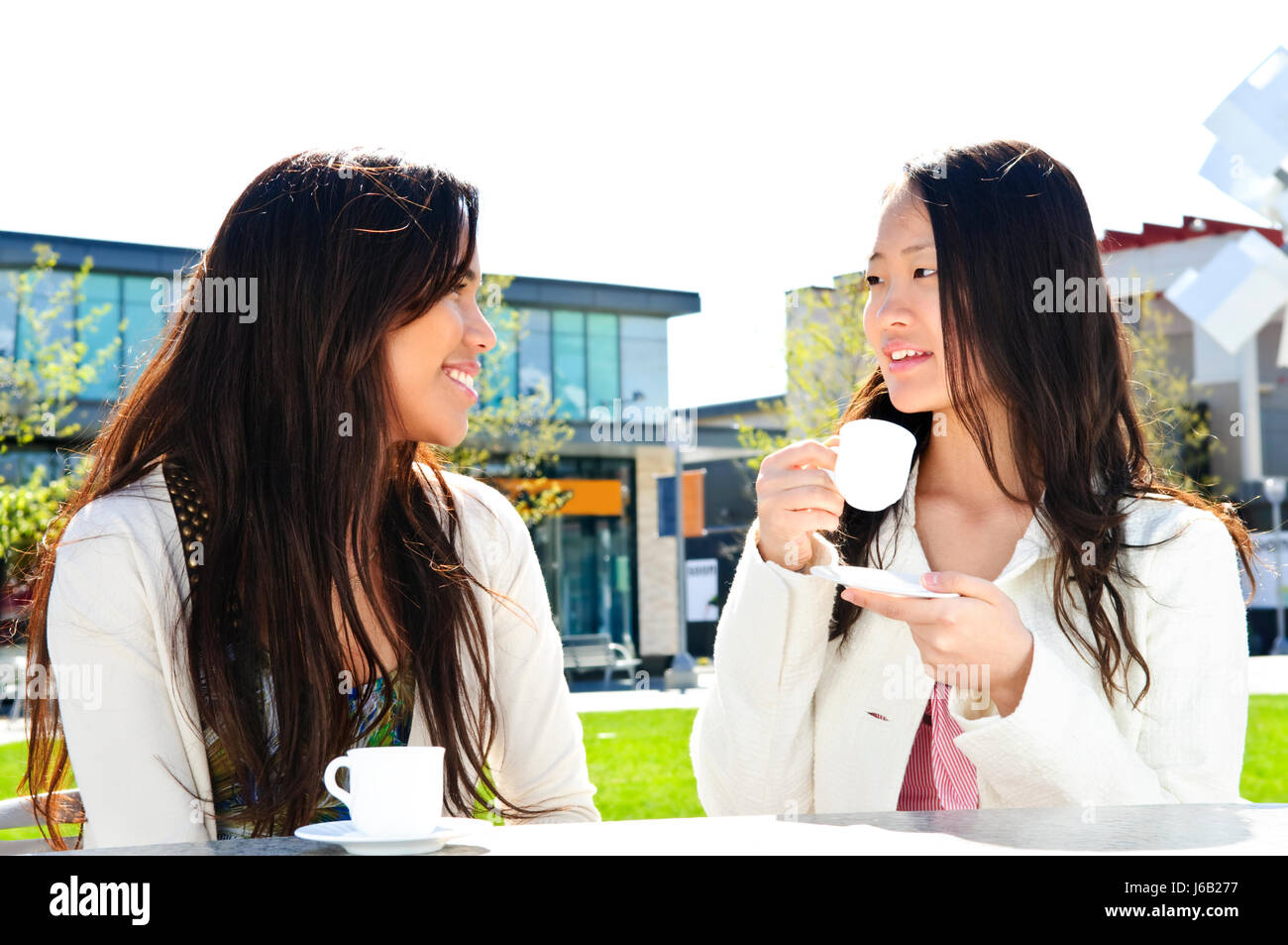 put sitting sit diverse mall girl girls friends woman talk speaking ...