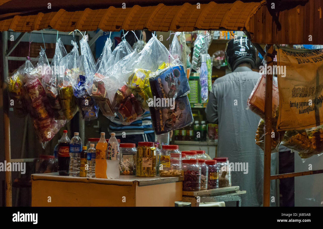 Street vendors cook food on their roadside stalls in Georgetown, Penang ...