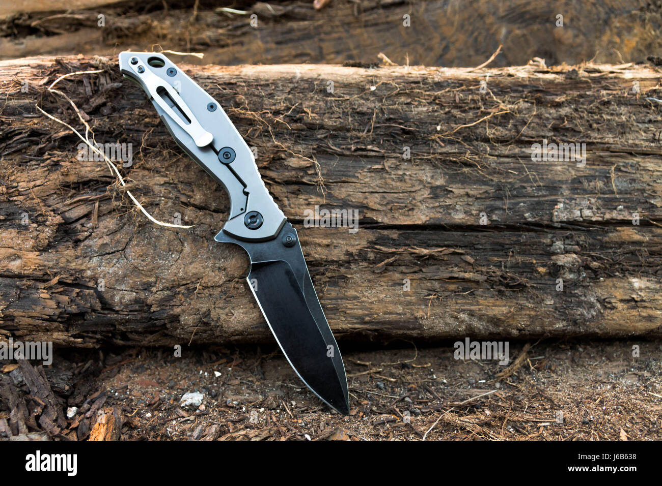 Knife for tactical tasks. Knife with a titanium handle Stock Photo - Alamy