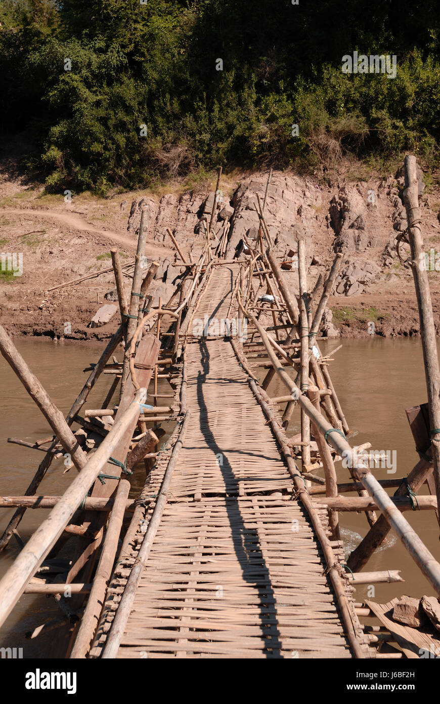 bridge cross shaky adventurous river water bridge primitive dangerous ...