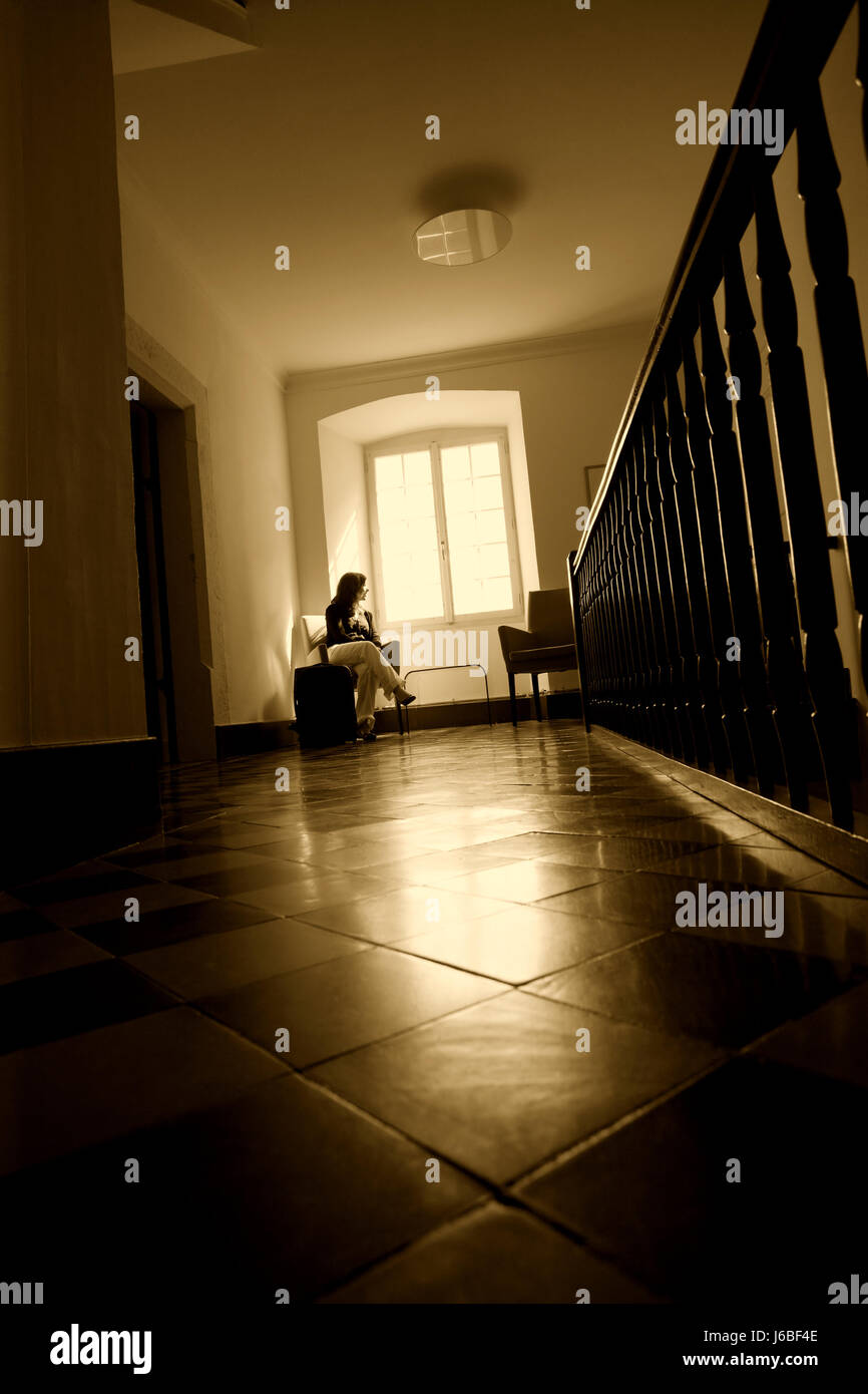 woman wait waiting female window porthole dormer window pane sunlight ...