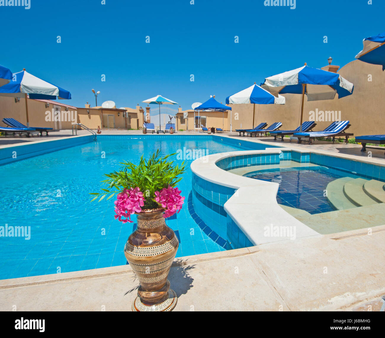 Luxury villa show home in tropical summer holiday resort with swimming ...