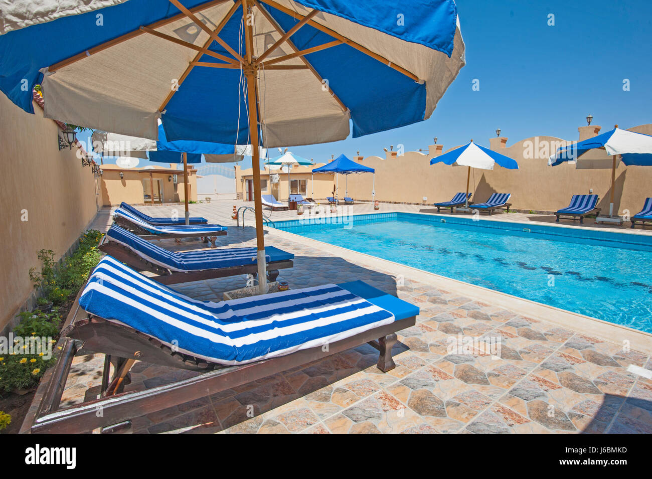 Luxury villa show home in tropical summer holiday resort with swimming ...