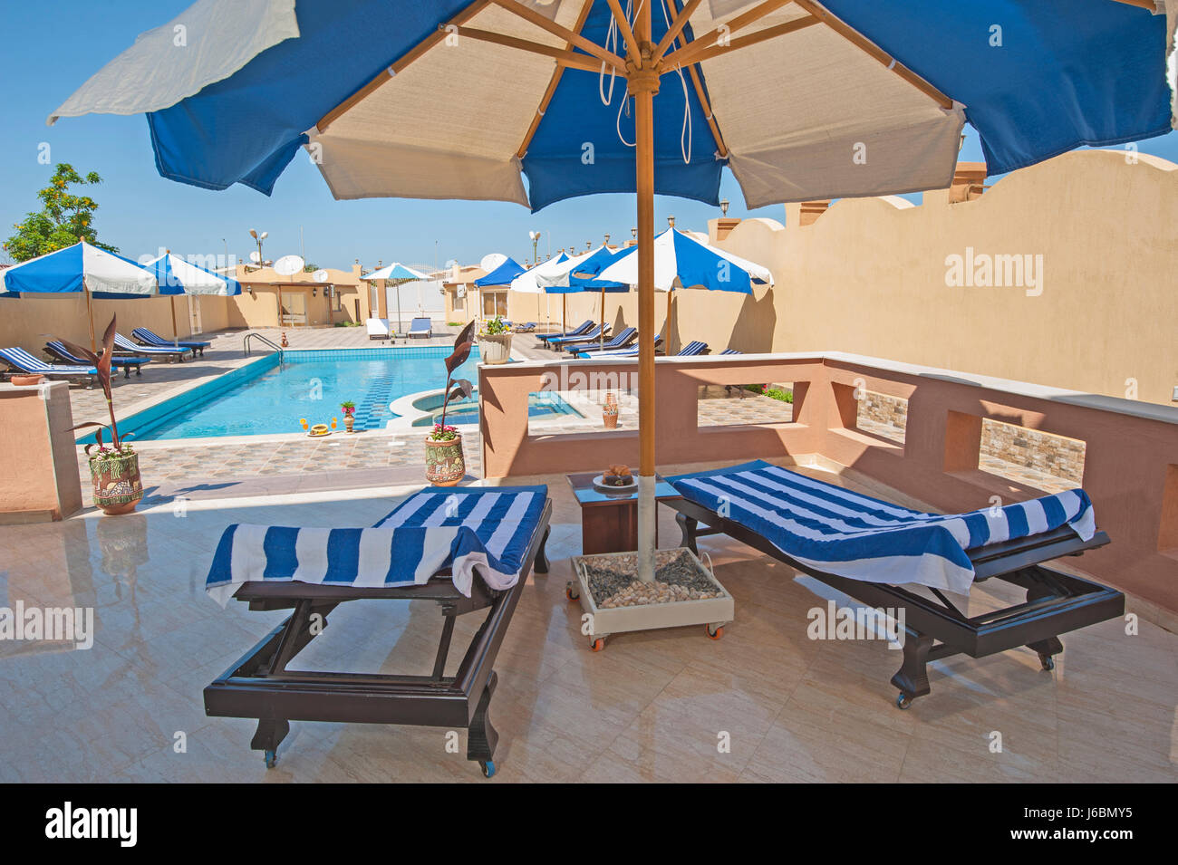 Luxury villa show home in tropical summer holiday resort with swimming ...