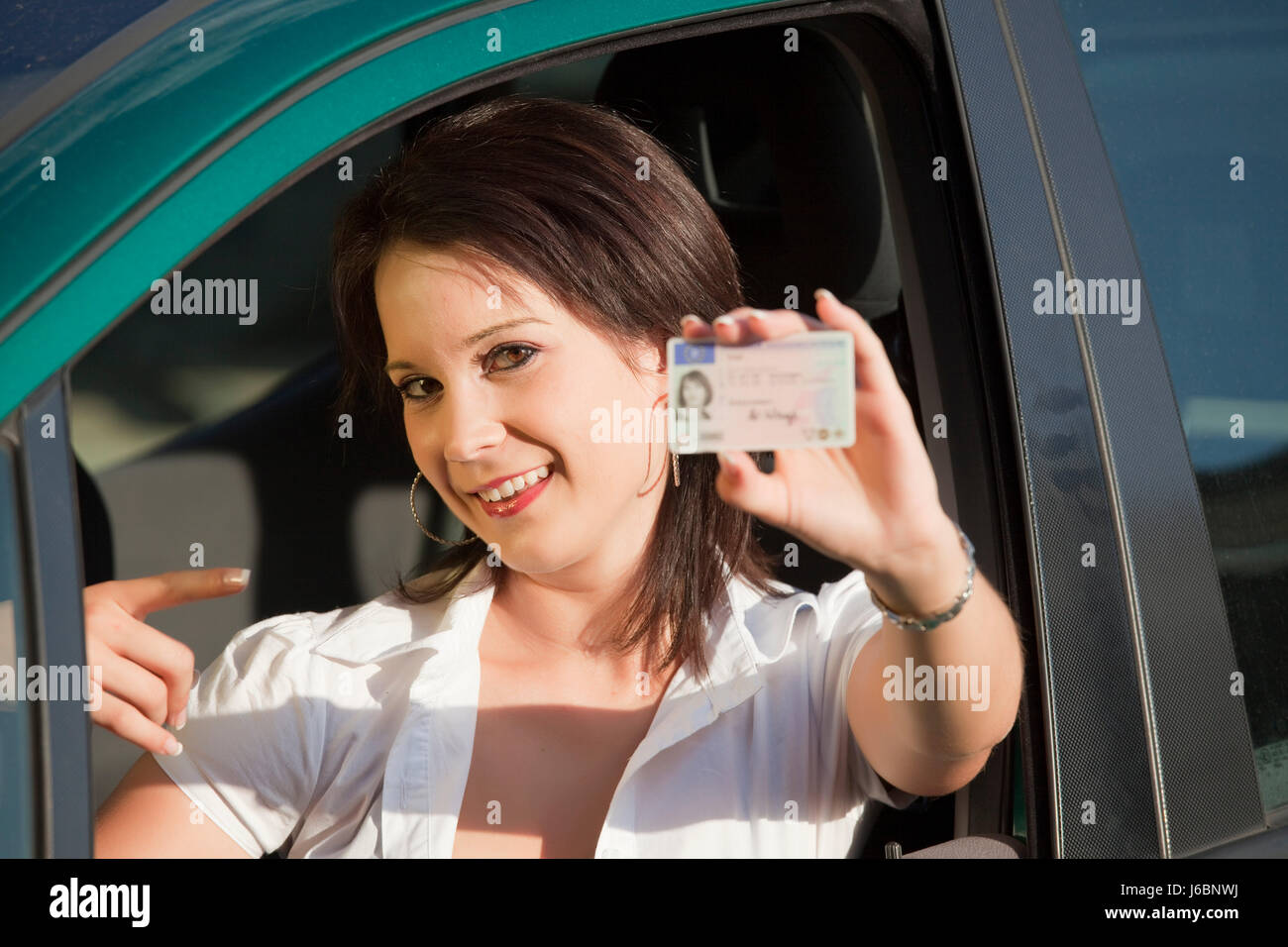 young woman showing new driving license Stock Photo - Alamy